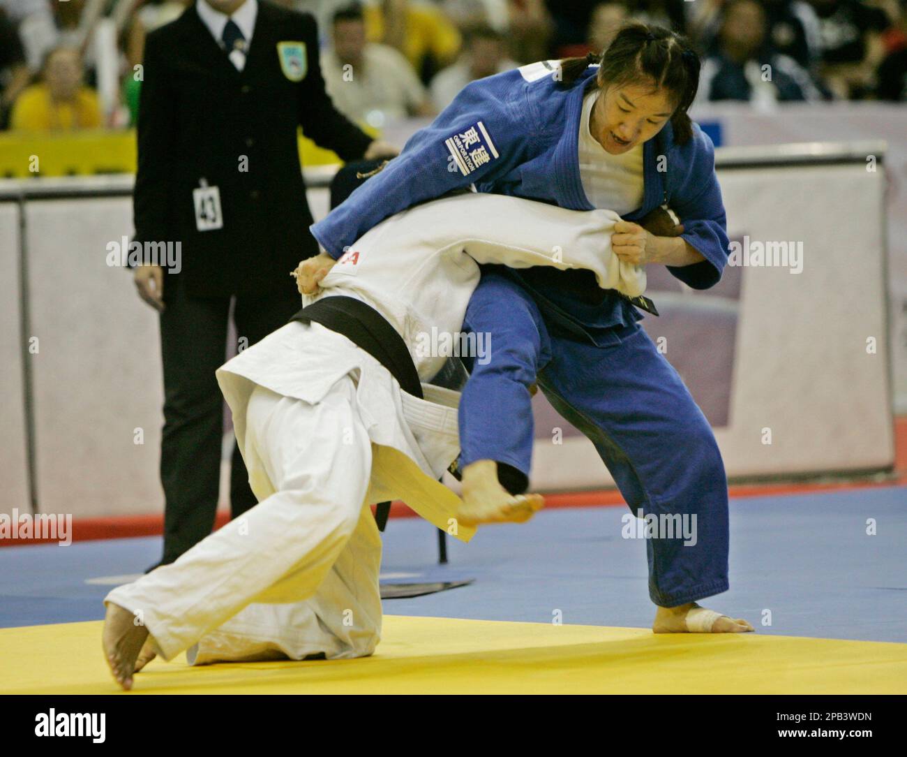 Japan's Ryoko Tani, right, fights with Cuba's Janet Bermoy during the ...
