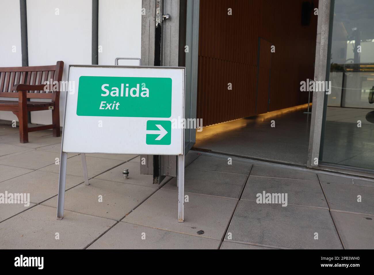 A Little Sign Board to Show Exit Way Both in English and Spanish ...
