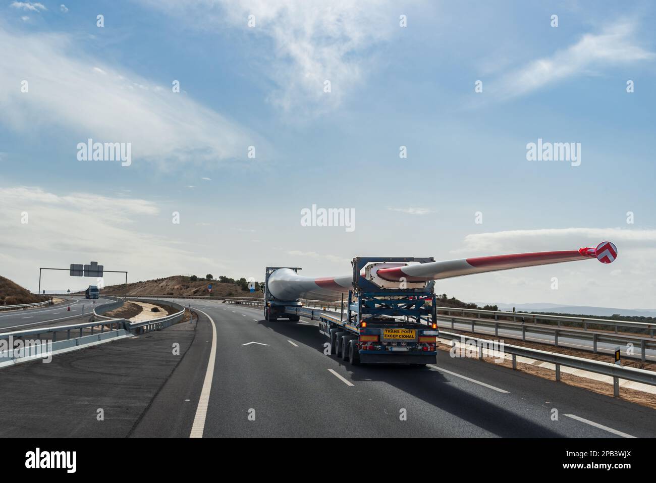 Special transport with a wind turbine blade driving on a highway Stock ...