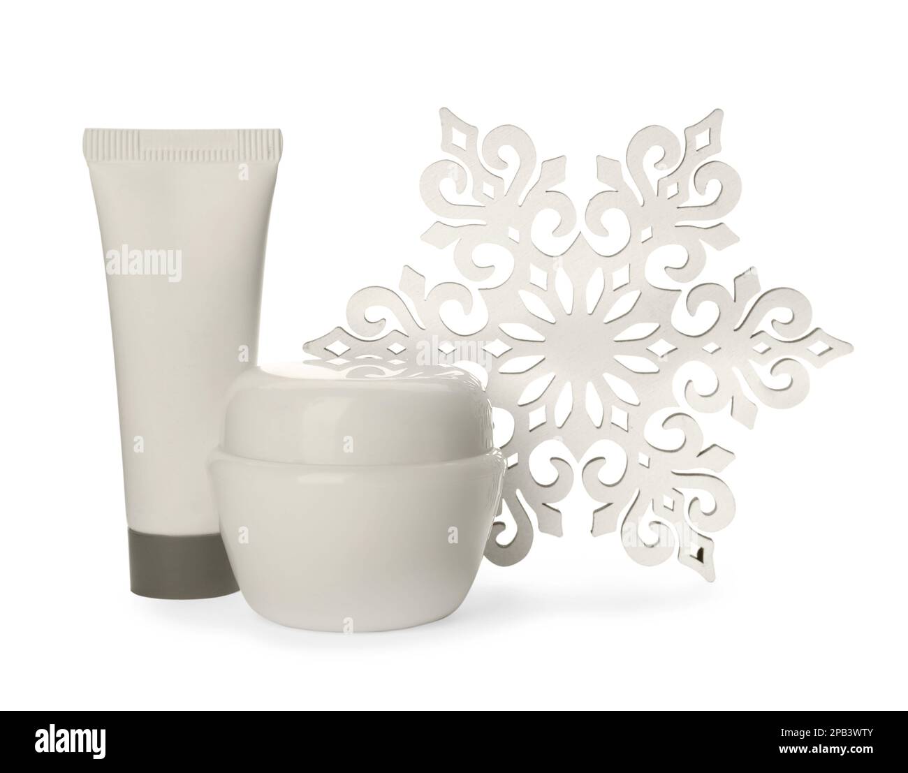 Cosmetic products and snowflake on white background. Winter skin care ...