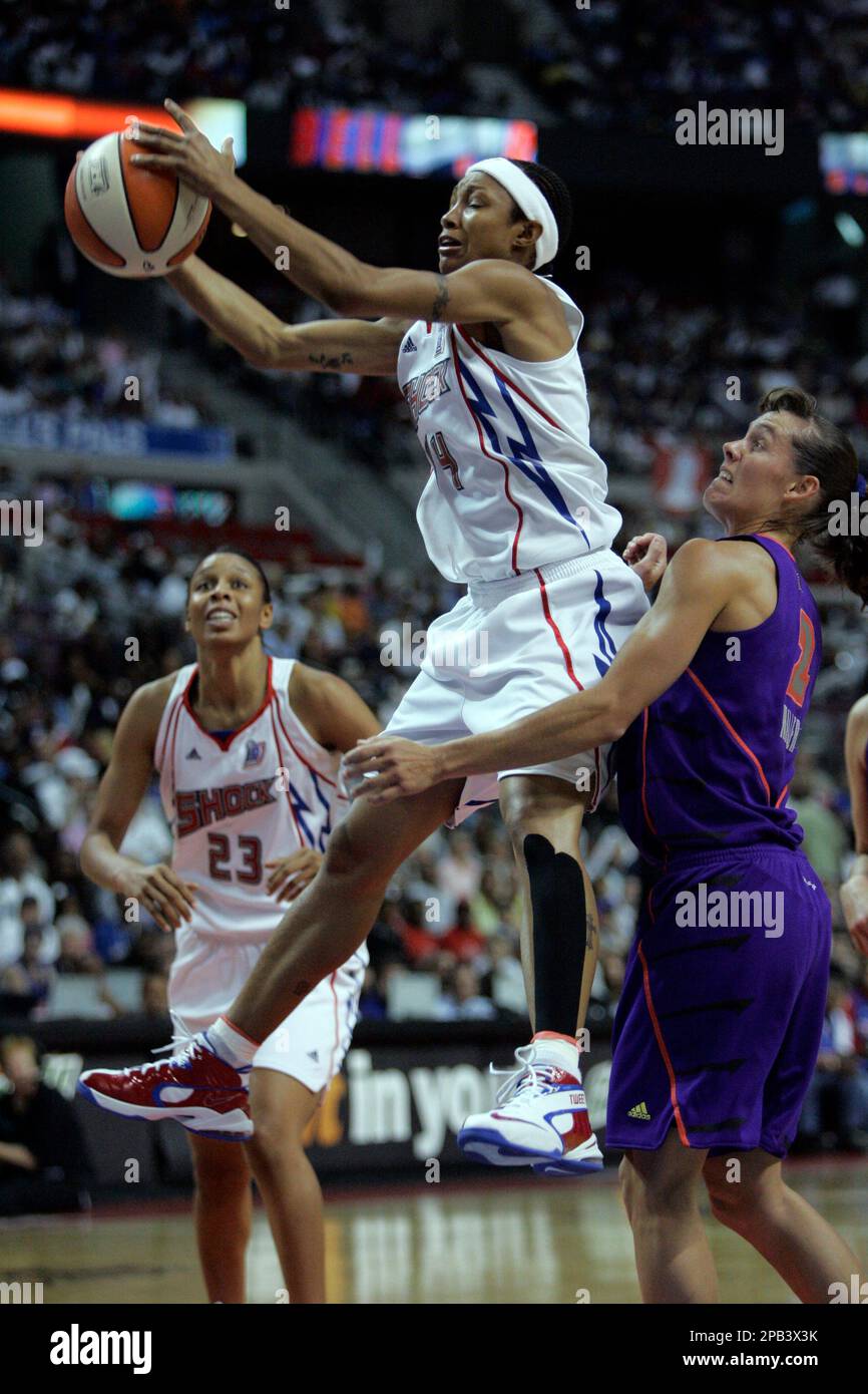 Detroit Shock guard Deanna Nolan, top, grabs a rebound in front of ...