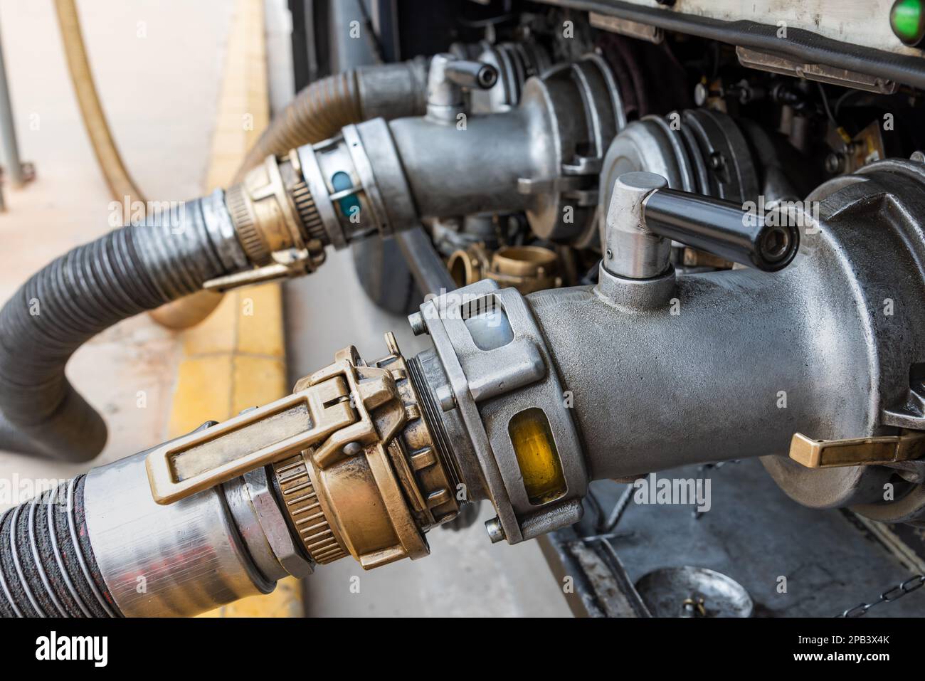 Devices attached to the mouths of a tanker truck to connect the ...
