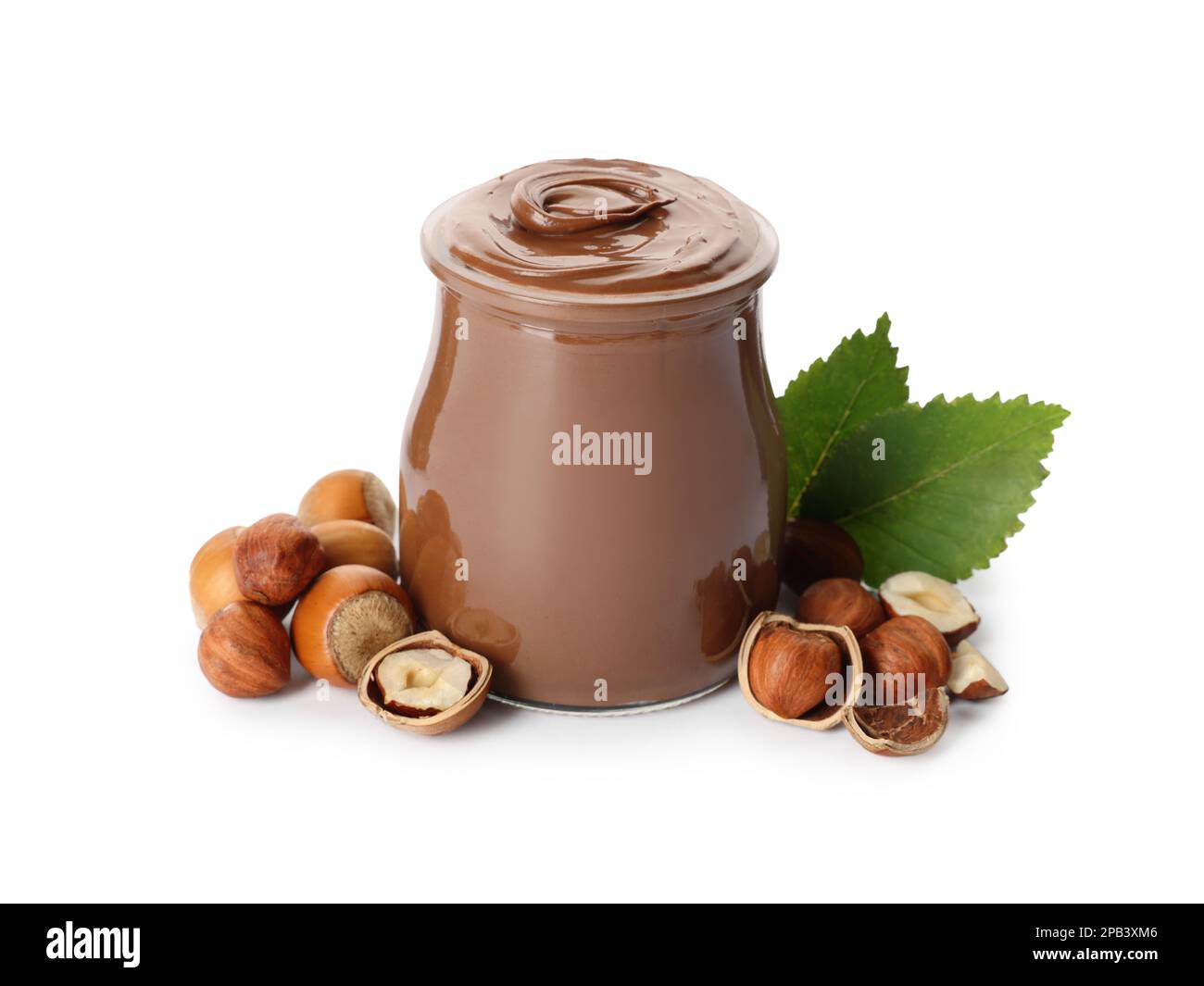 Glass jar with tasty chocolate hazelnut spread and nuts on white ...