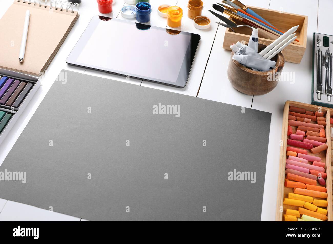Blank sheet of paper, colorful chalk pastels, tablet and other drawing ...