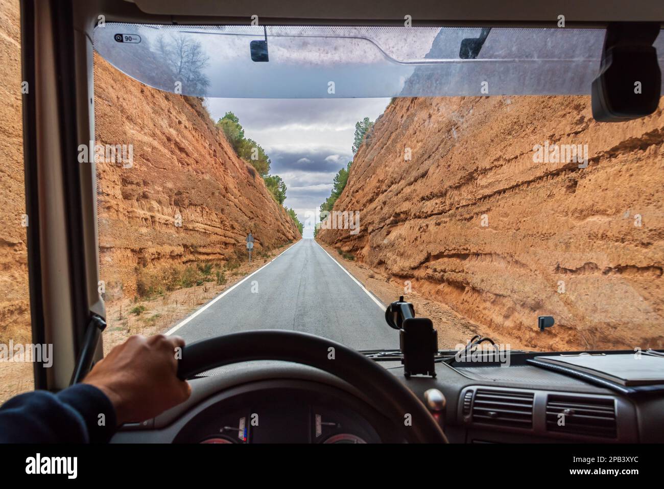 View from the driving position of a truck driving on a narrow road ...