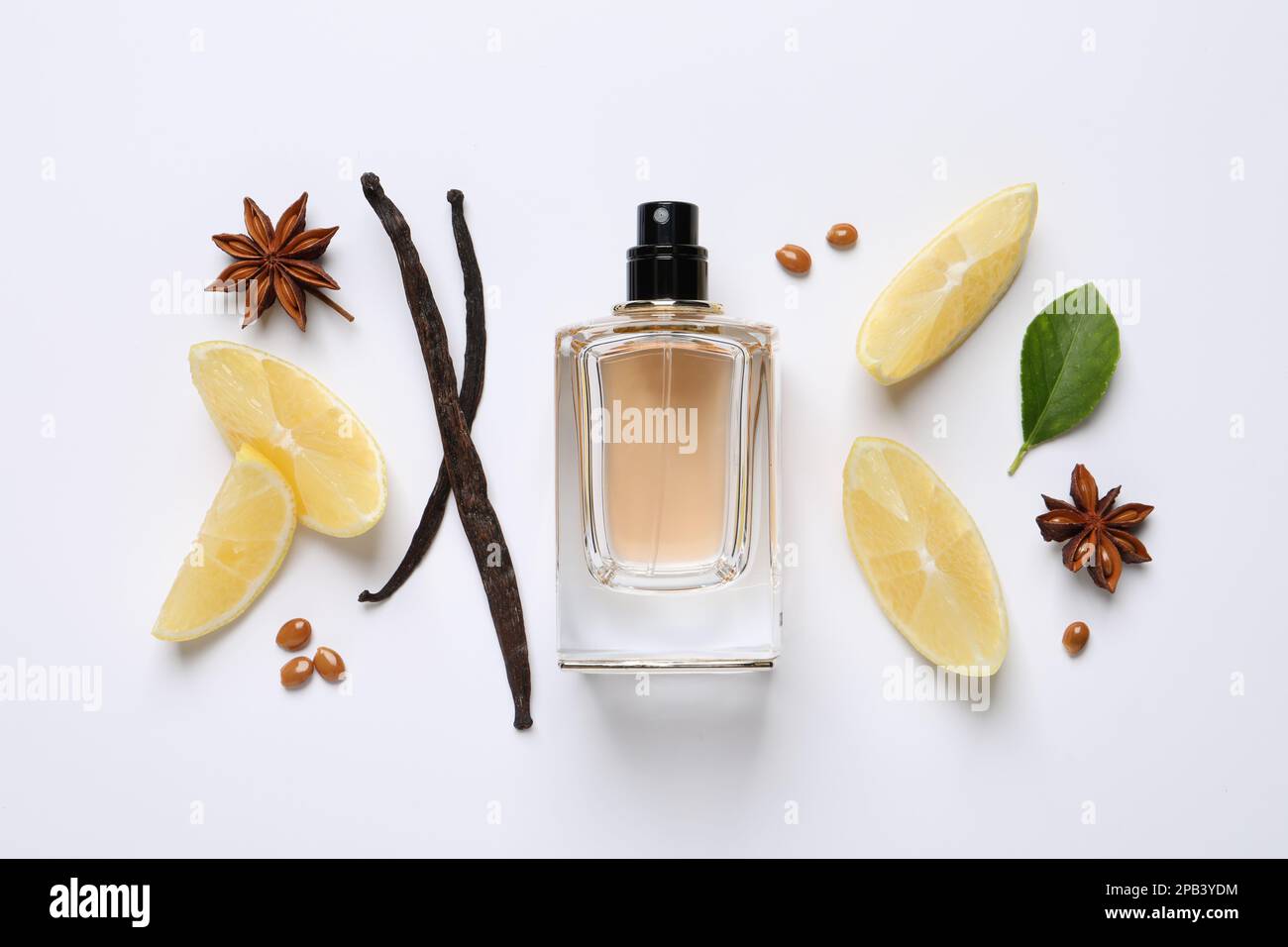 Flat lay composition with bottle of perfume, spices and lemon on white ...