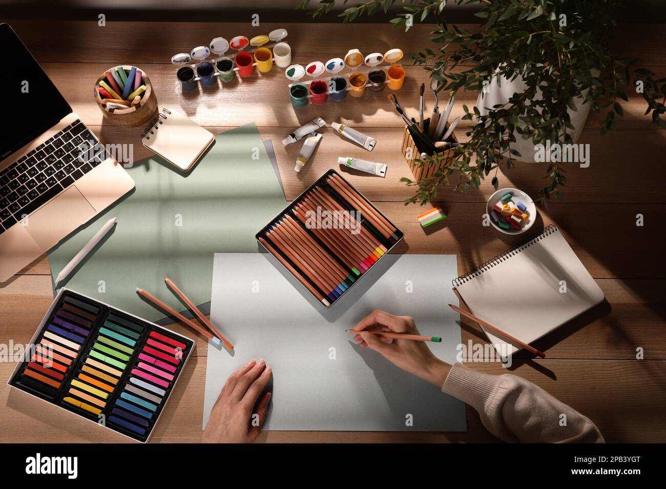 Artist drawing with pastel pencil at table, top view Stock Photo - Alamy