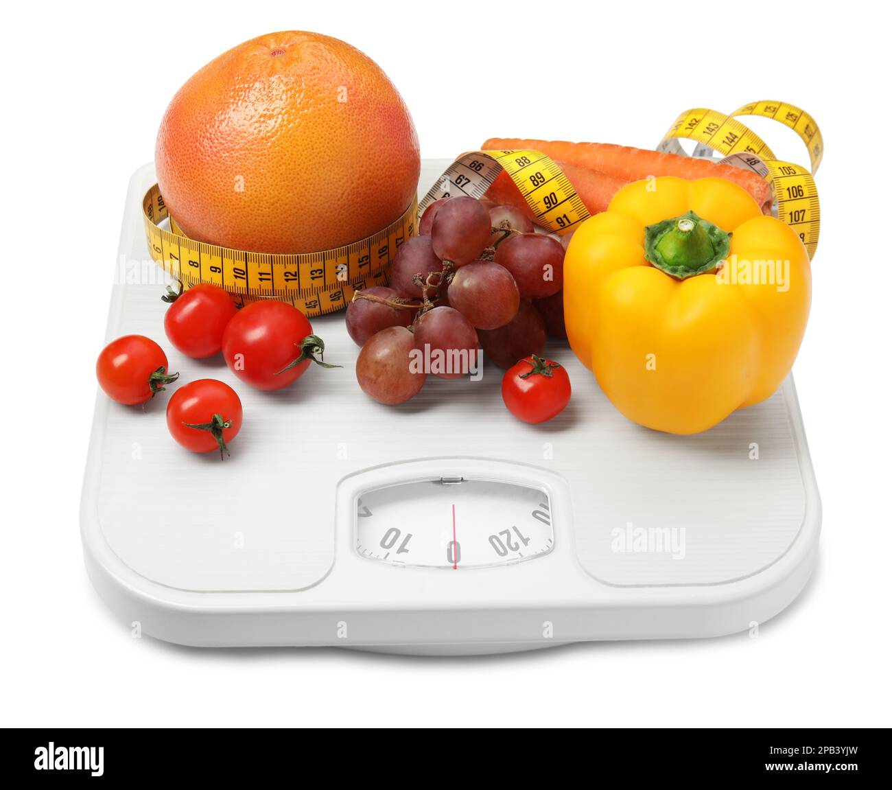 Scales, vegetables and measuring tape on white background Stock Photo ...