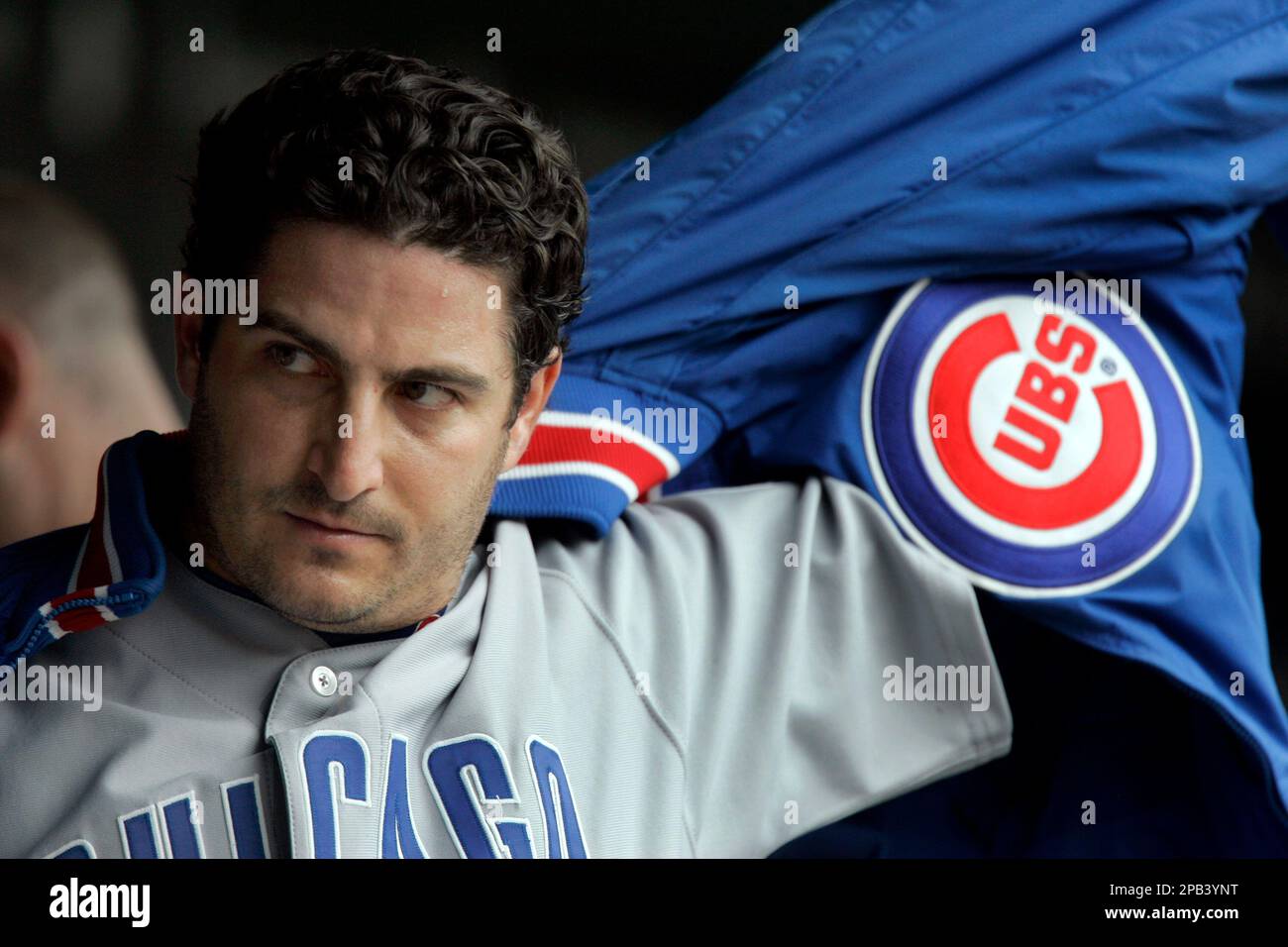 Chicago Cubs starting pitcher Jason Marquis puts on his jacket in the ...