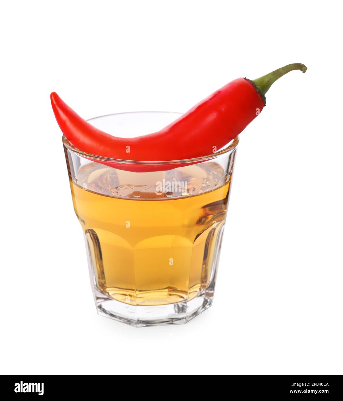 Red hot chili pepper and vodka in glass on white background Stock Photo ...