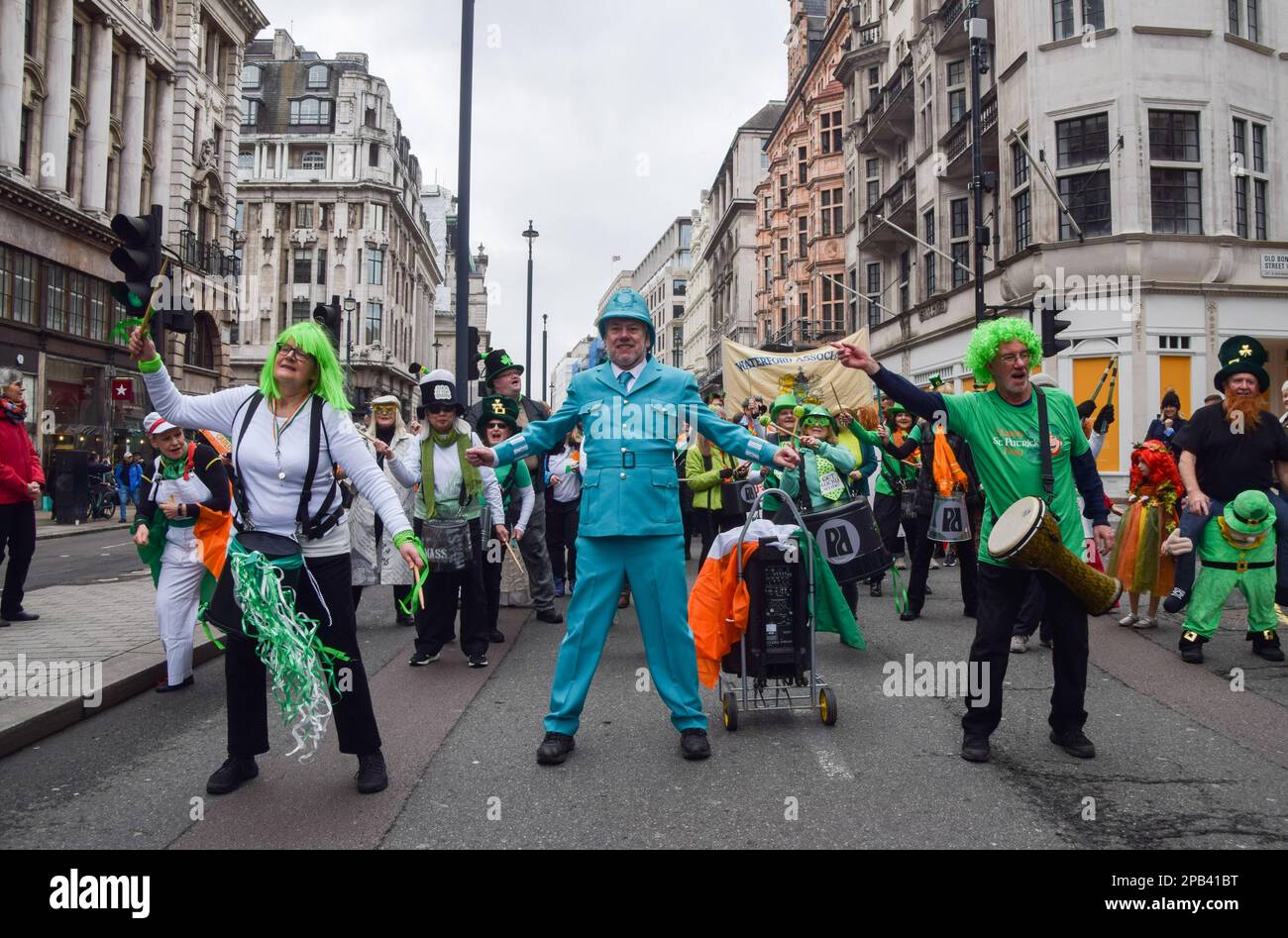 London, UK. 12th March 2023. St Patrick’s Day Parade passes through ...