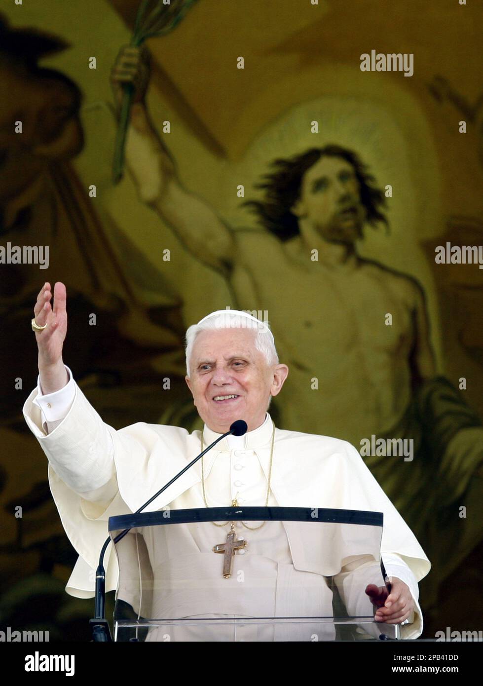 Pope Benedict XVI greets faithful during the Angelus prayer from his ...