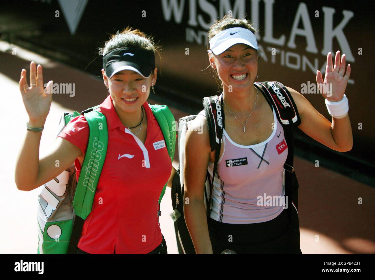 Chinese Ji Chunmei, right, and Sun Shengnan, left, wave to fans after ...