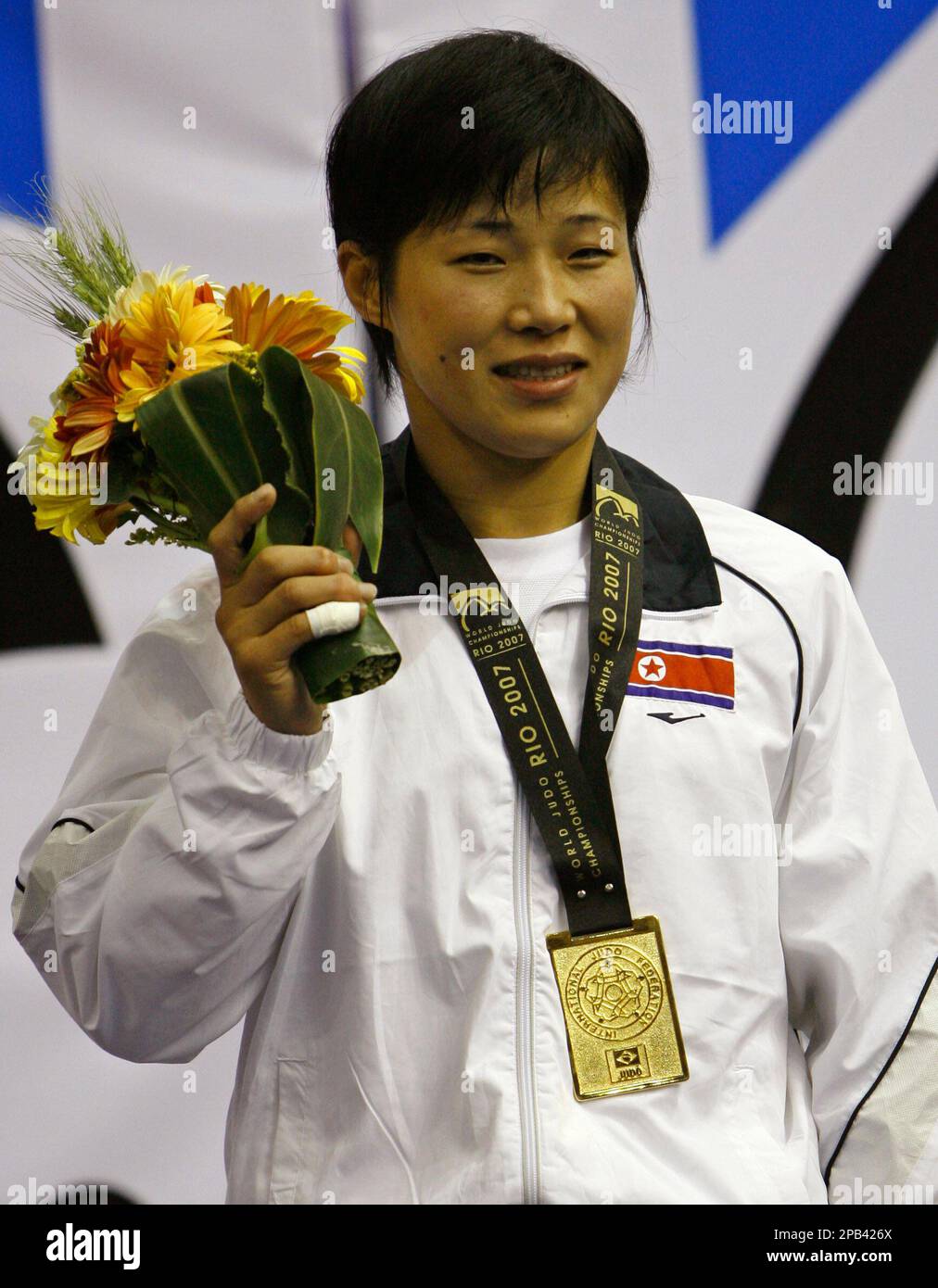 North Korea's Sun Hui Kye wears her gold medal during the medals ...