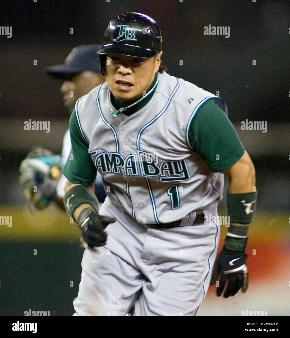 Tampa Bay Devil Rays' Akinori Iwamura heads back to first base against ...