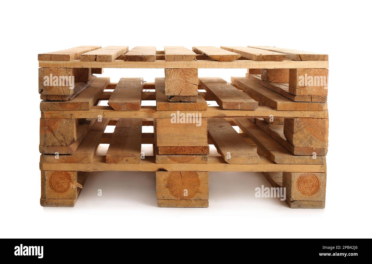 Stacked wooden pallets isolated on white. Transportation and storage ...