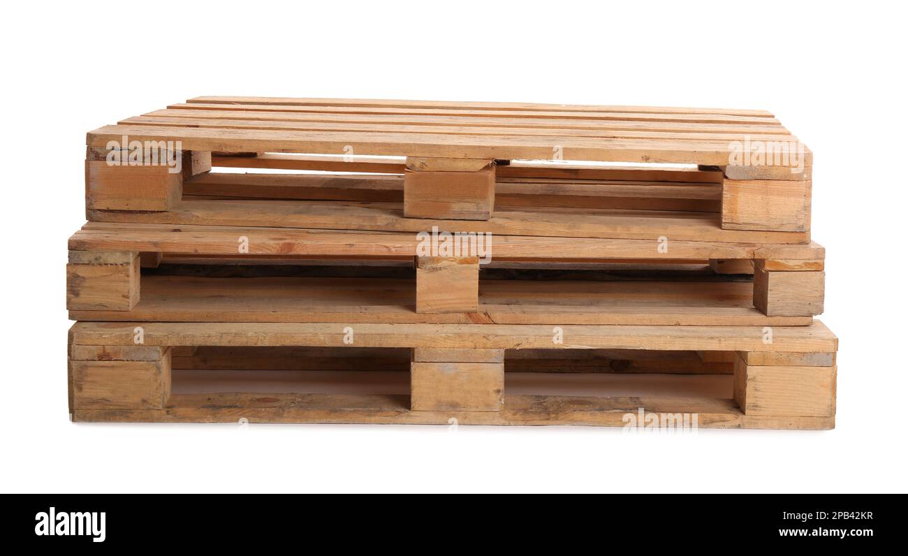 Stacked wooden pallets isolated on white. Transportation and storage ...