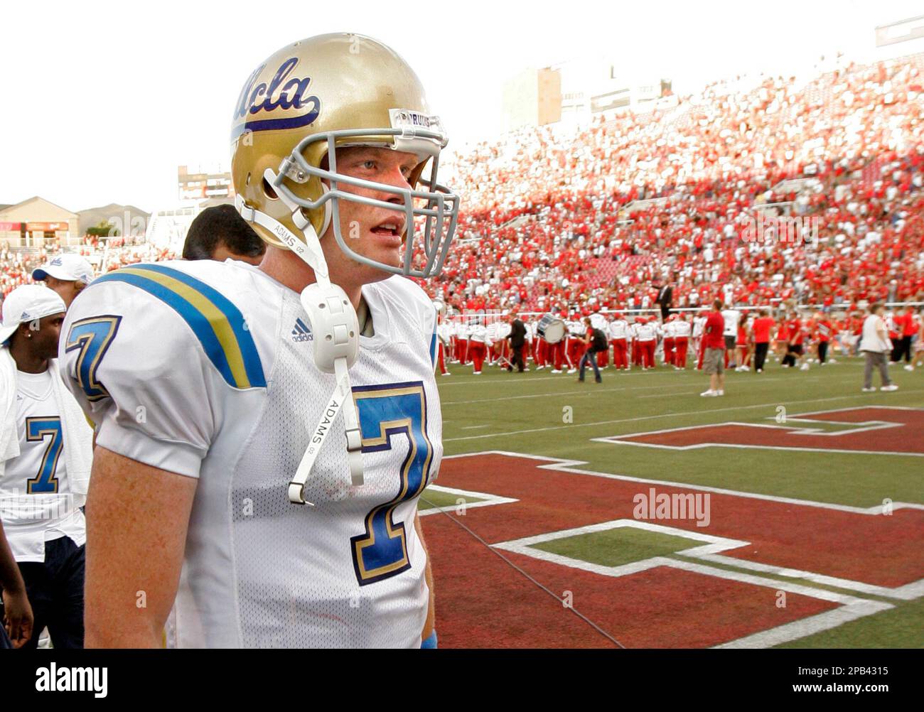 UCLA quarterback Ben Olson (7) heads off the field as the Utah team and ...