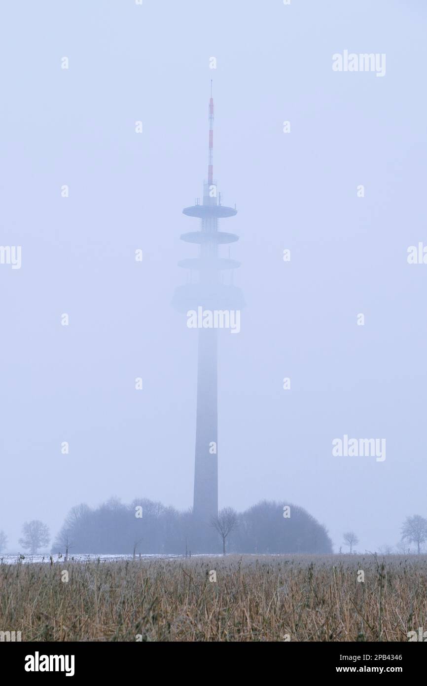 Telecommunication tower in the fog Stock Photo - Alamy