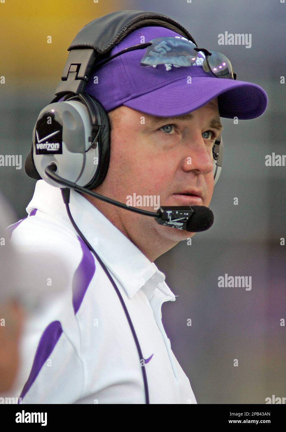 East Carolina coach Skip Holtz watches a replay during the first half ...