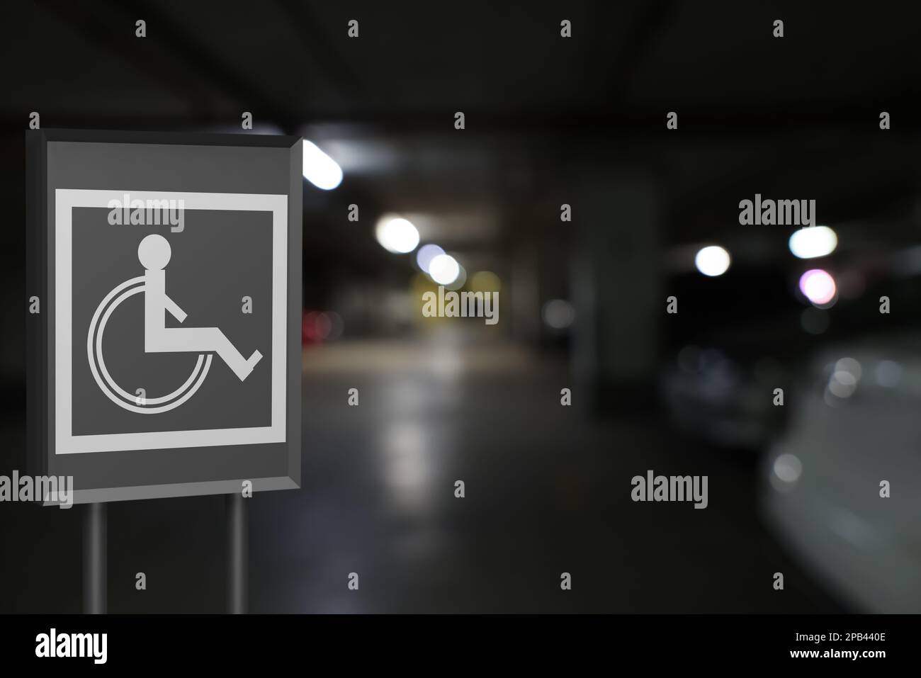 Sign with wheelchair symbol in car parking garage, space for text Stock ...