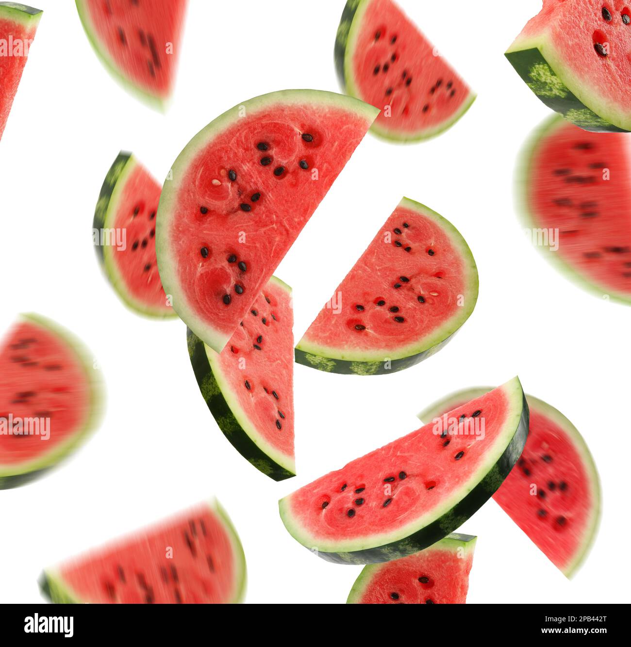 Slices of delicious ripe watermelon falling on white background Stock ...
