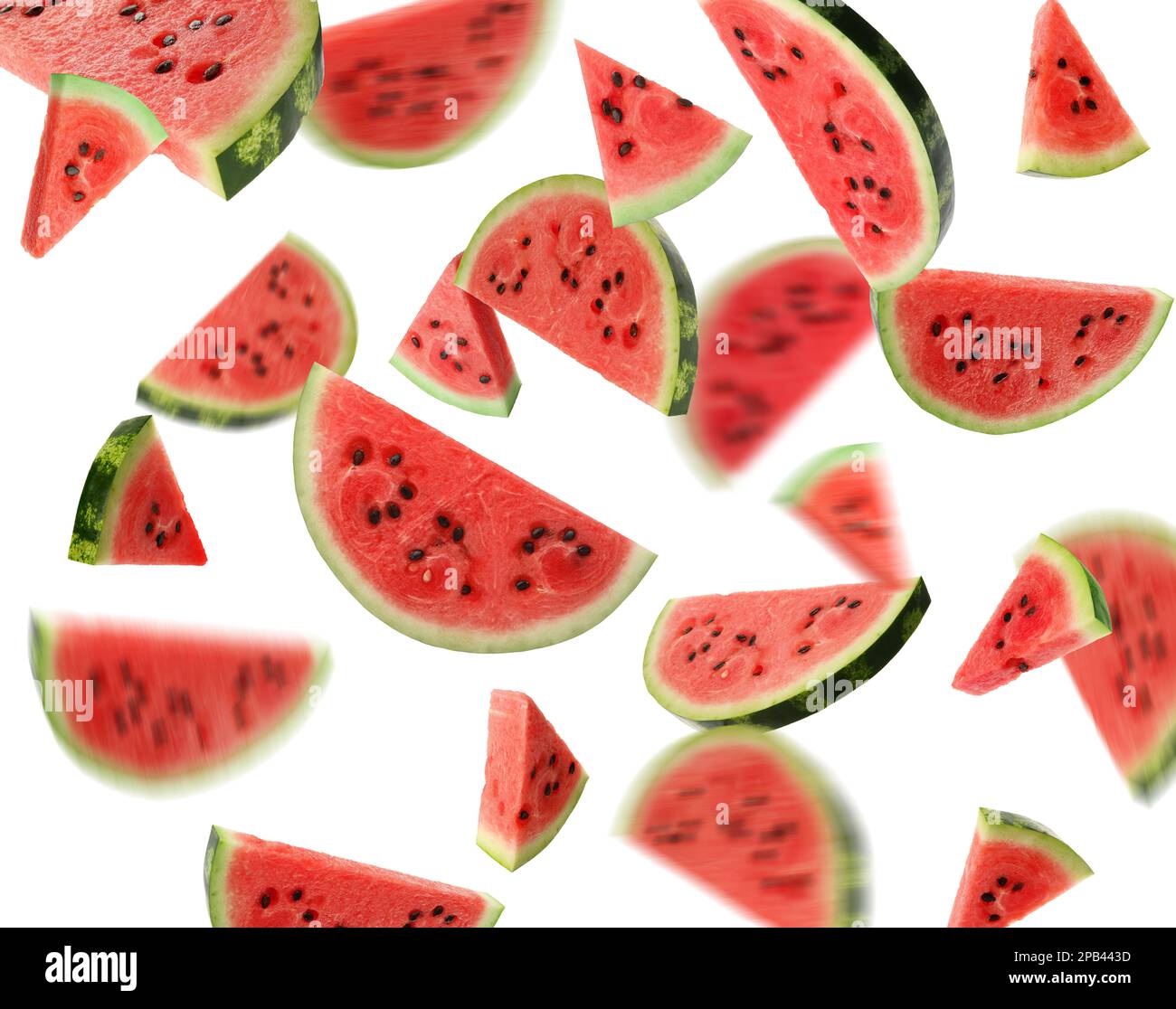 Slices of delicious ripe watermelon falling on white background Stock ...