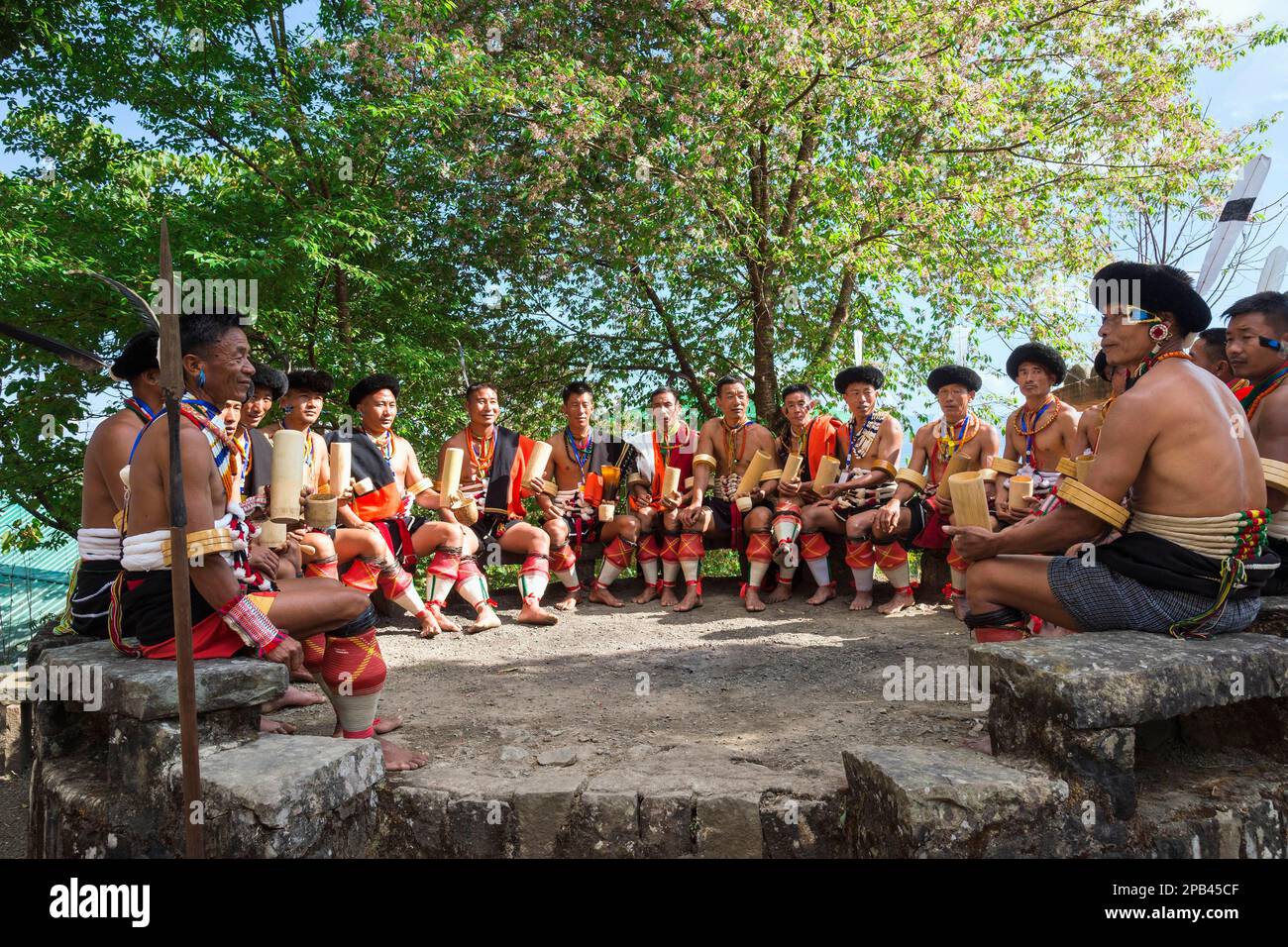 Naga tribesmen in front of a traditional house, Kisima Nagaland ...