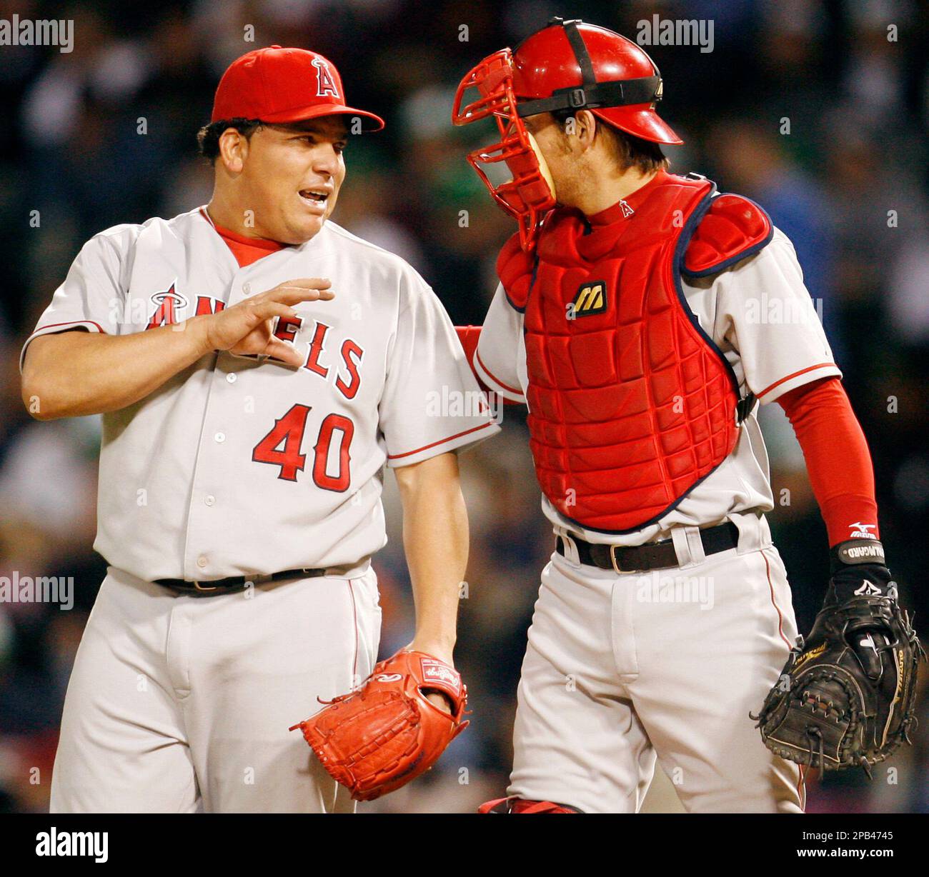 Los Angeles Angels starting pitcher Bartolo Colon, left, talks to ...