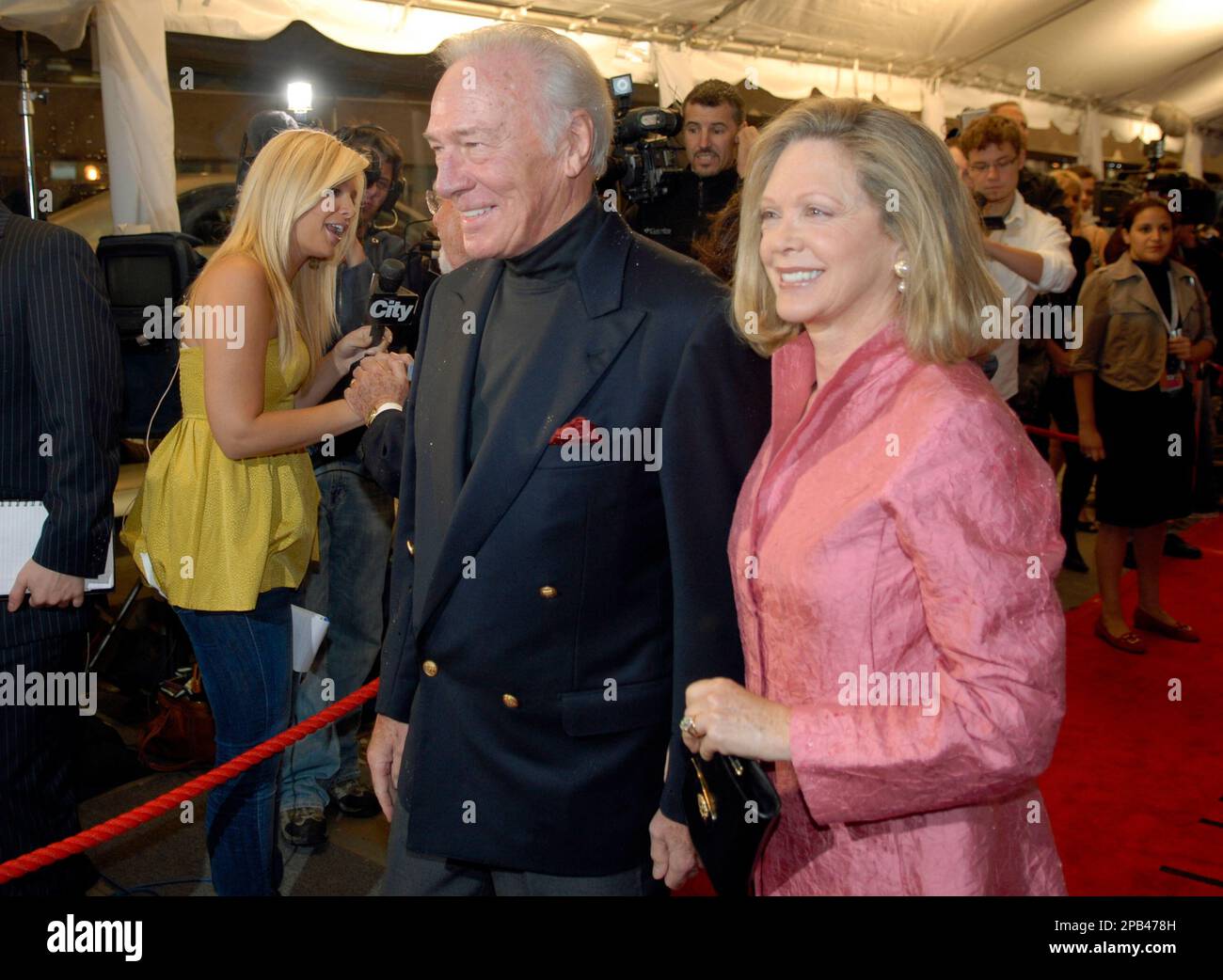 Christopher Plummer, left, arrives for the gala premiere of "Closing ...