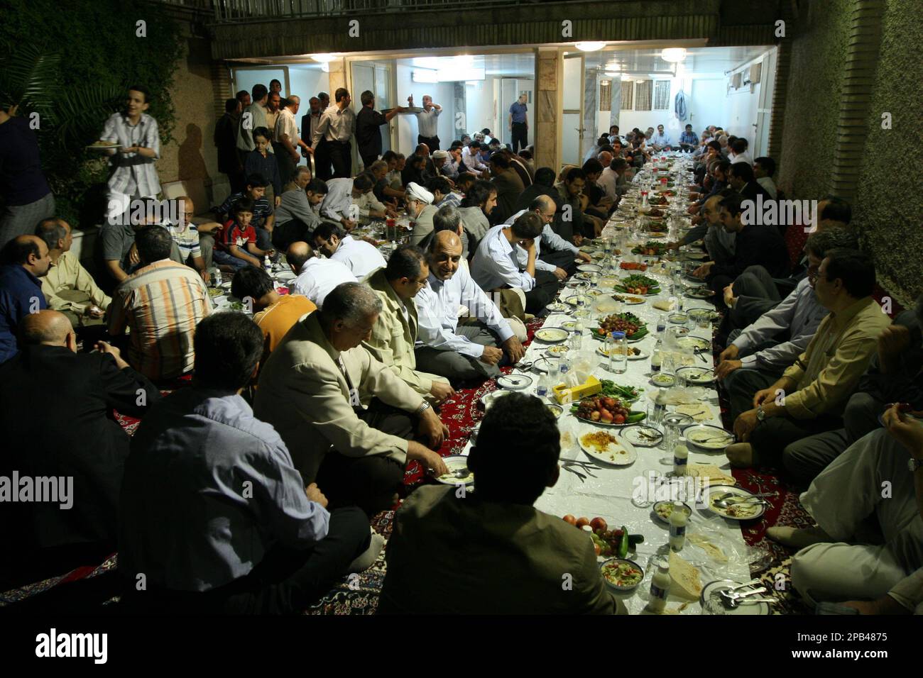Iranian Muslims break their fast with Iftar, the evening meal, in the ...