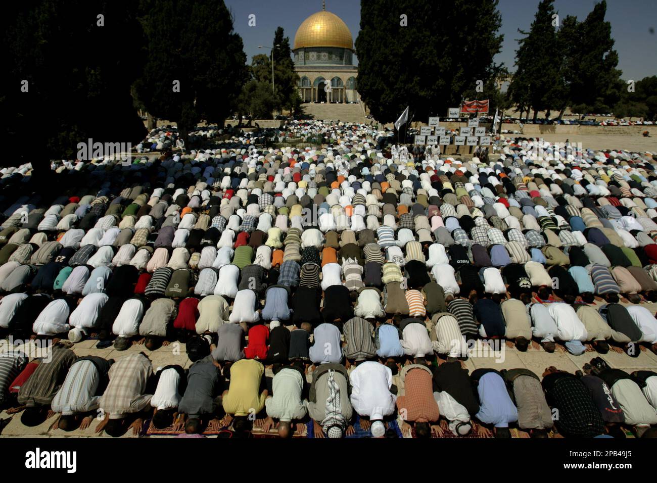 With the Dome of the Rock Mosque seen in the background, thousands of ...