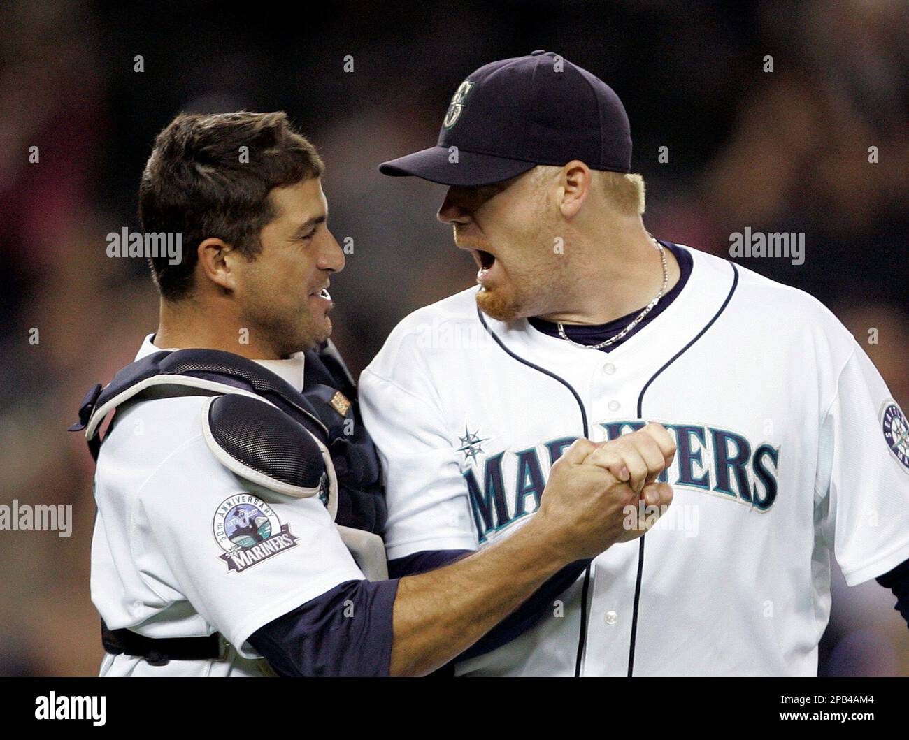 Seattle Mariners closer J.J. Putz, right, greets catcher Jamie Burke ...