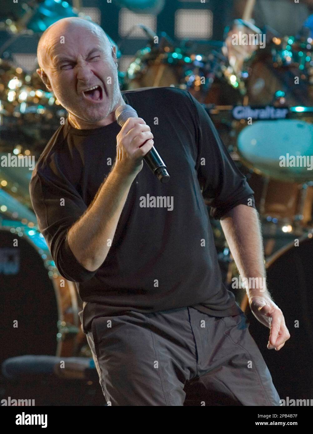 Phil Collins of the band Genesis rehearse with the band for their ...