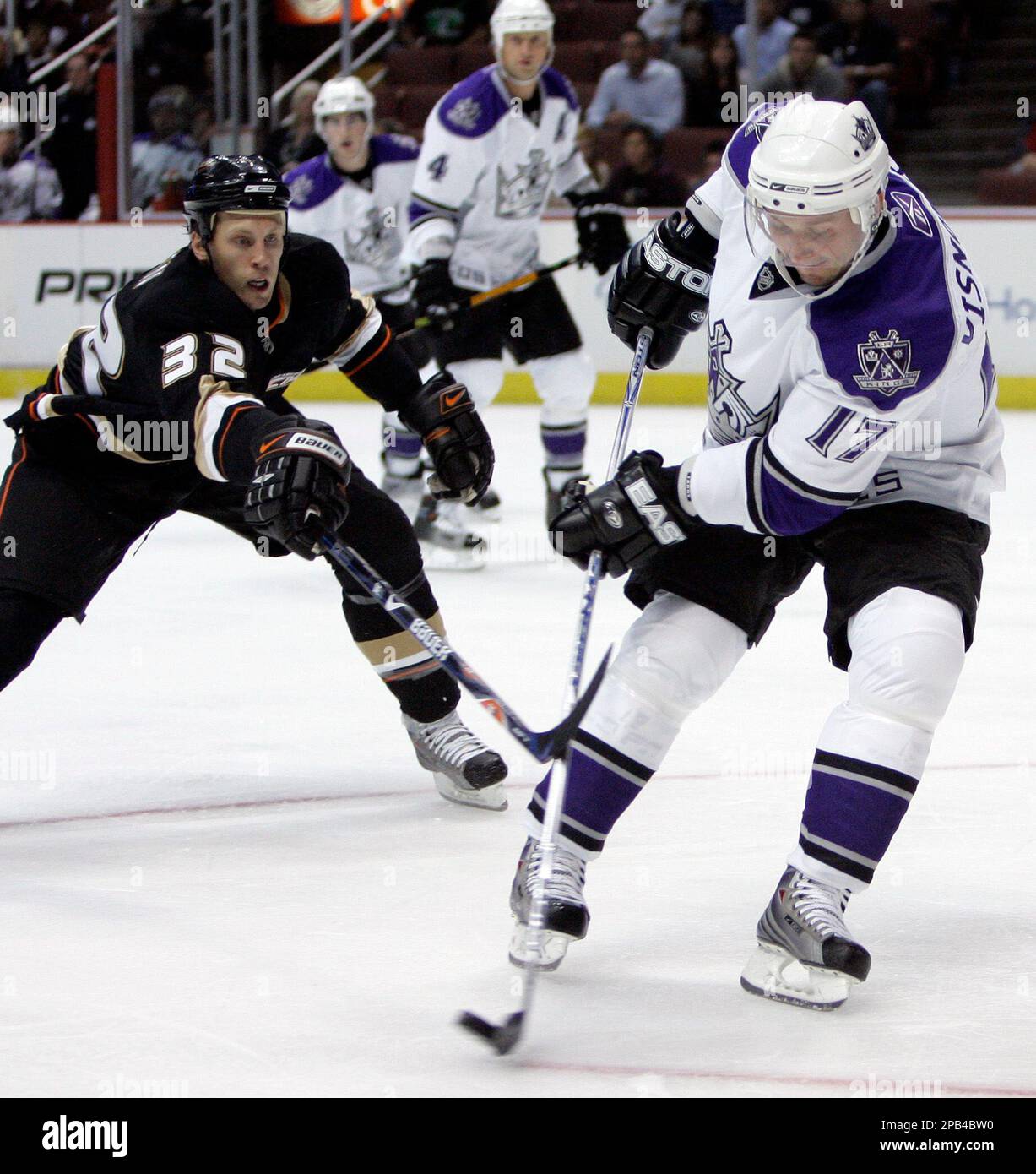 Los Angeles Kings defenseman Lubomir Visnovsky, right, shoots around ...