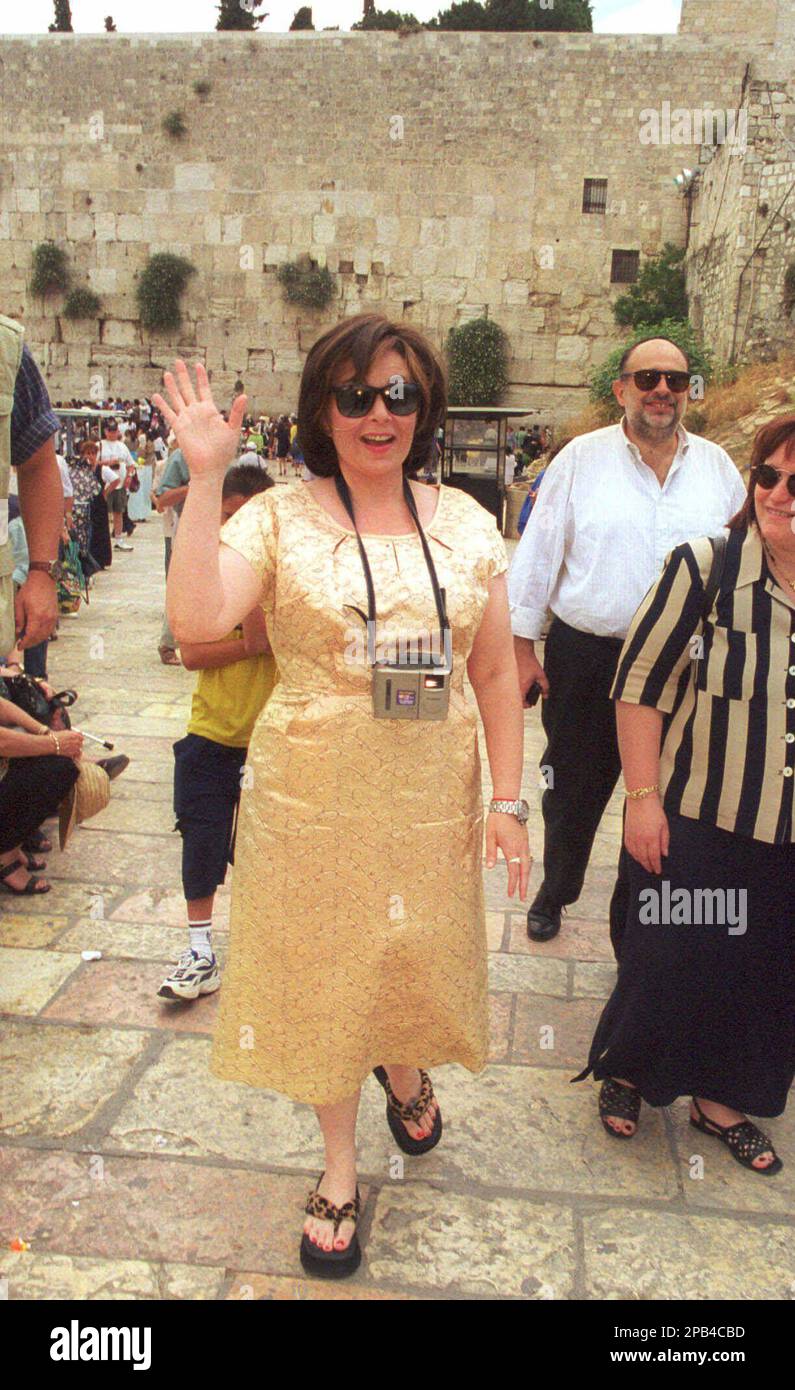 American actress and talk show host Roseanne Barr waves as she leaves ...