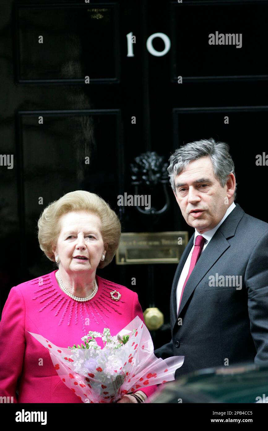 Britain's former Prime Minister Margaret Thatcher, left, is seen off by ...
