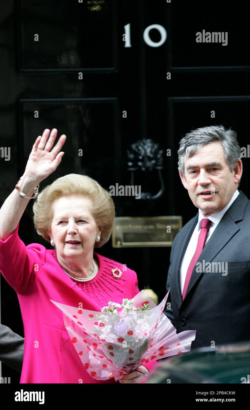 Britain's former Prime Minister Margaret Thatcher, left, waves to the ...