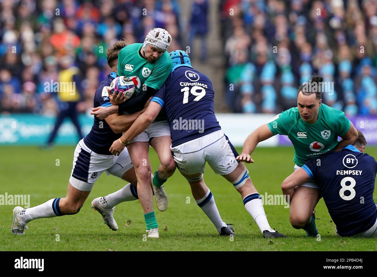 Ireland’s Mack Hansen is tackled by Scotland’s Scott Cummings during ...