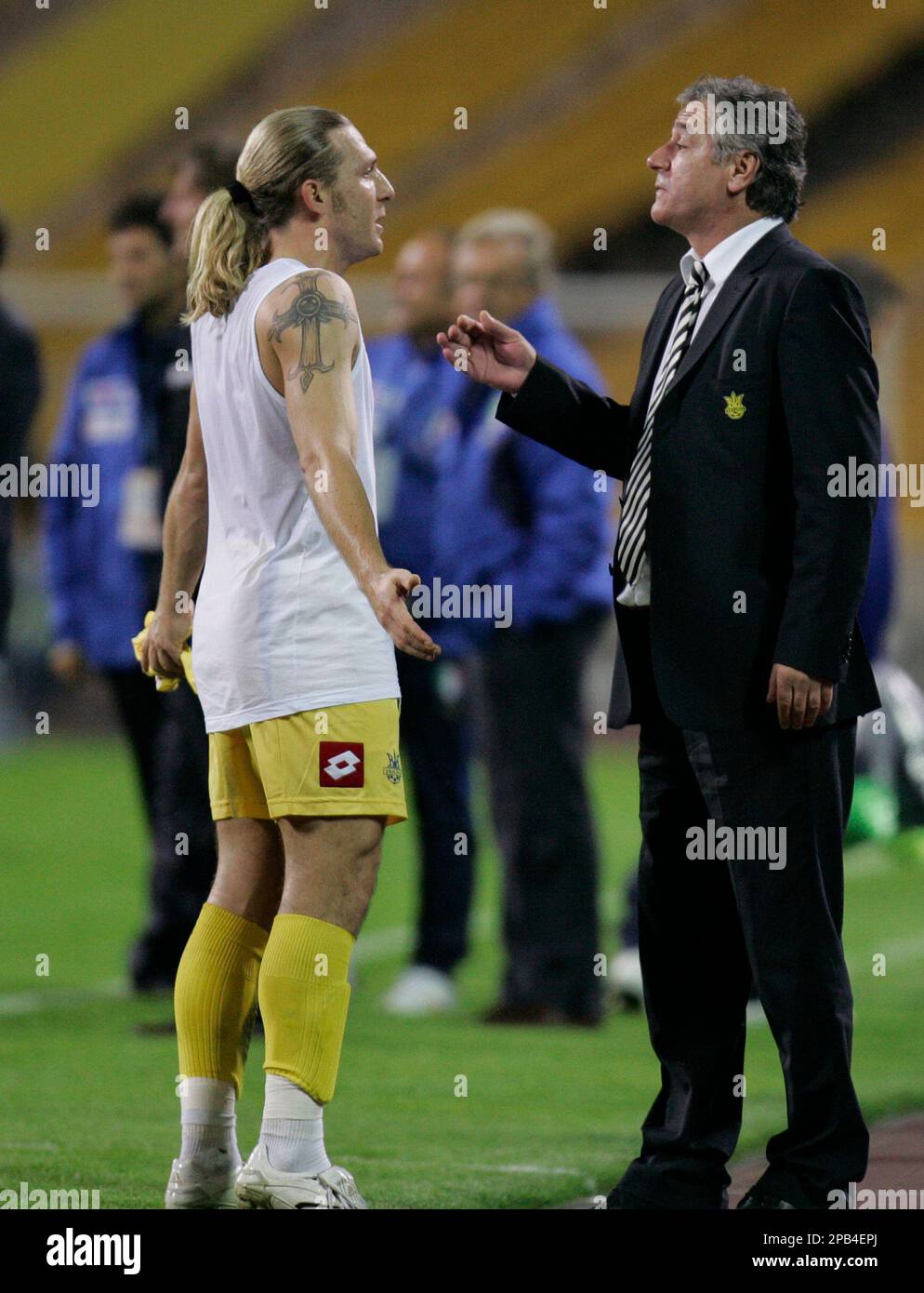 Ukraine's Andriy Voronin, left, listens to team's assistant coach ...