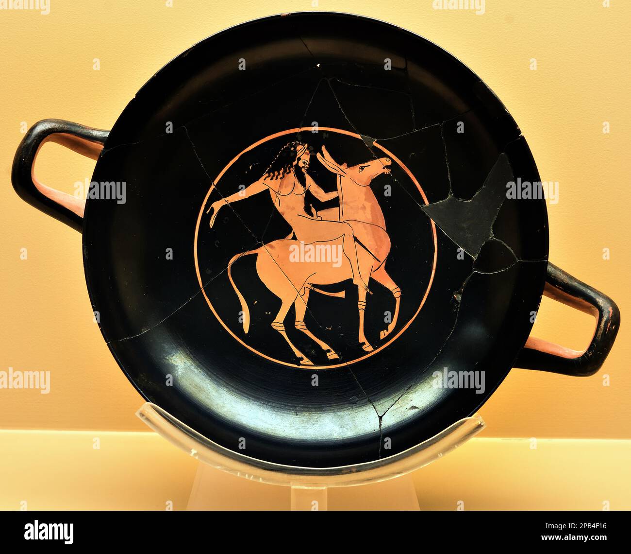 Satyr riding on a donkey; inscription: ΕΠΟΙΕΣΕΝ - Kylix by Epiktetos ...