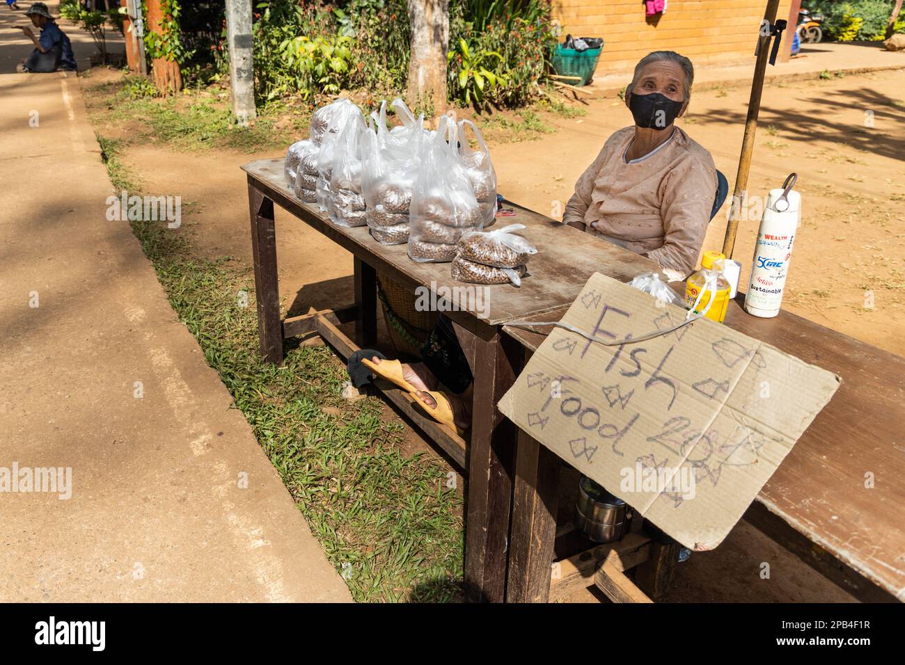 MAE HONG SON, THAILAND, March 10, 2023: Vendors selling fish food ...