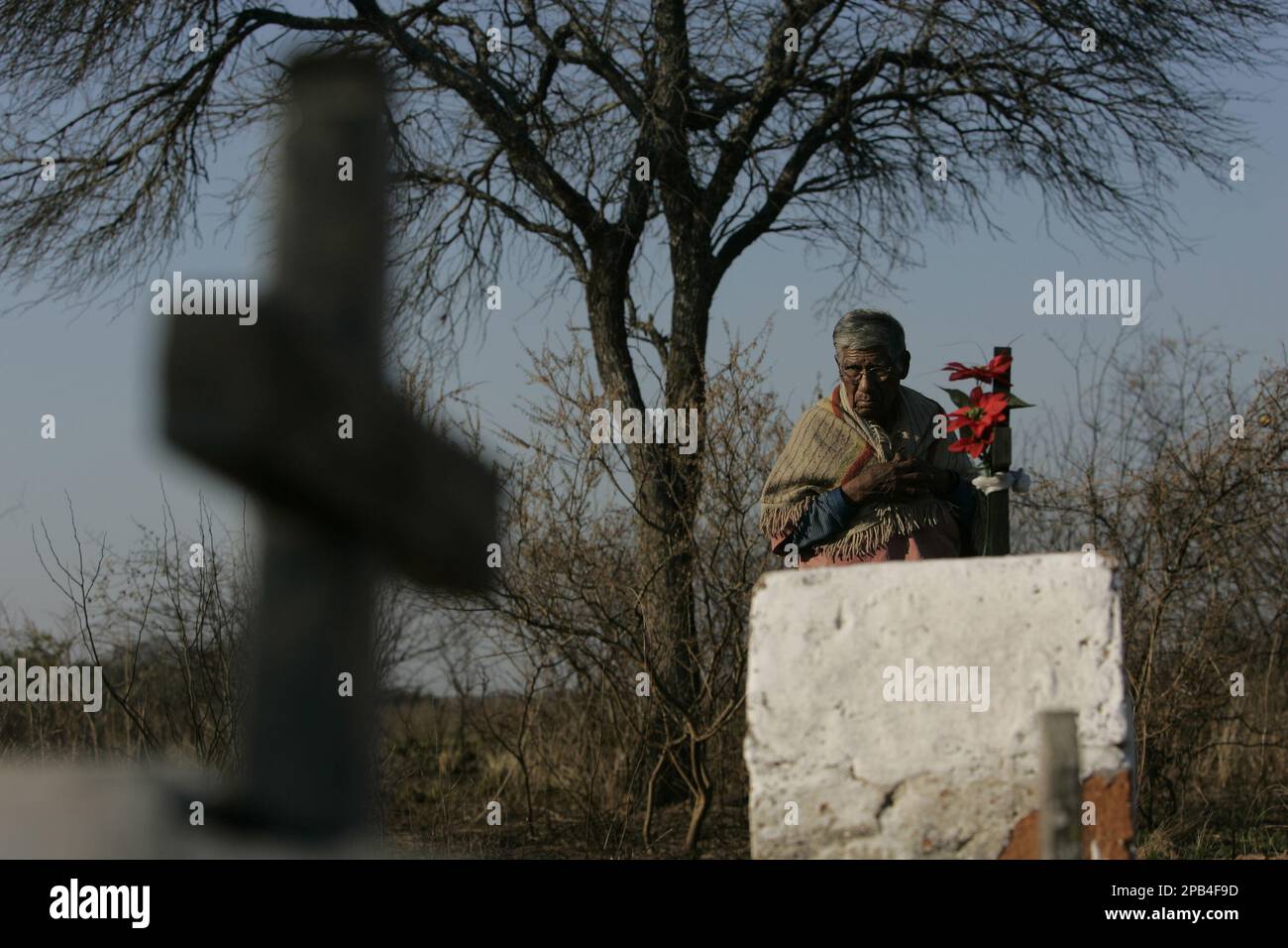 Toba Indian Jose Pino Fernandez stands near his daughter's tomb in the ...