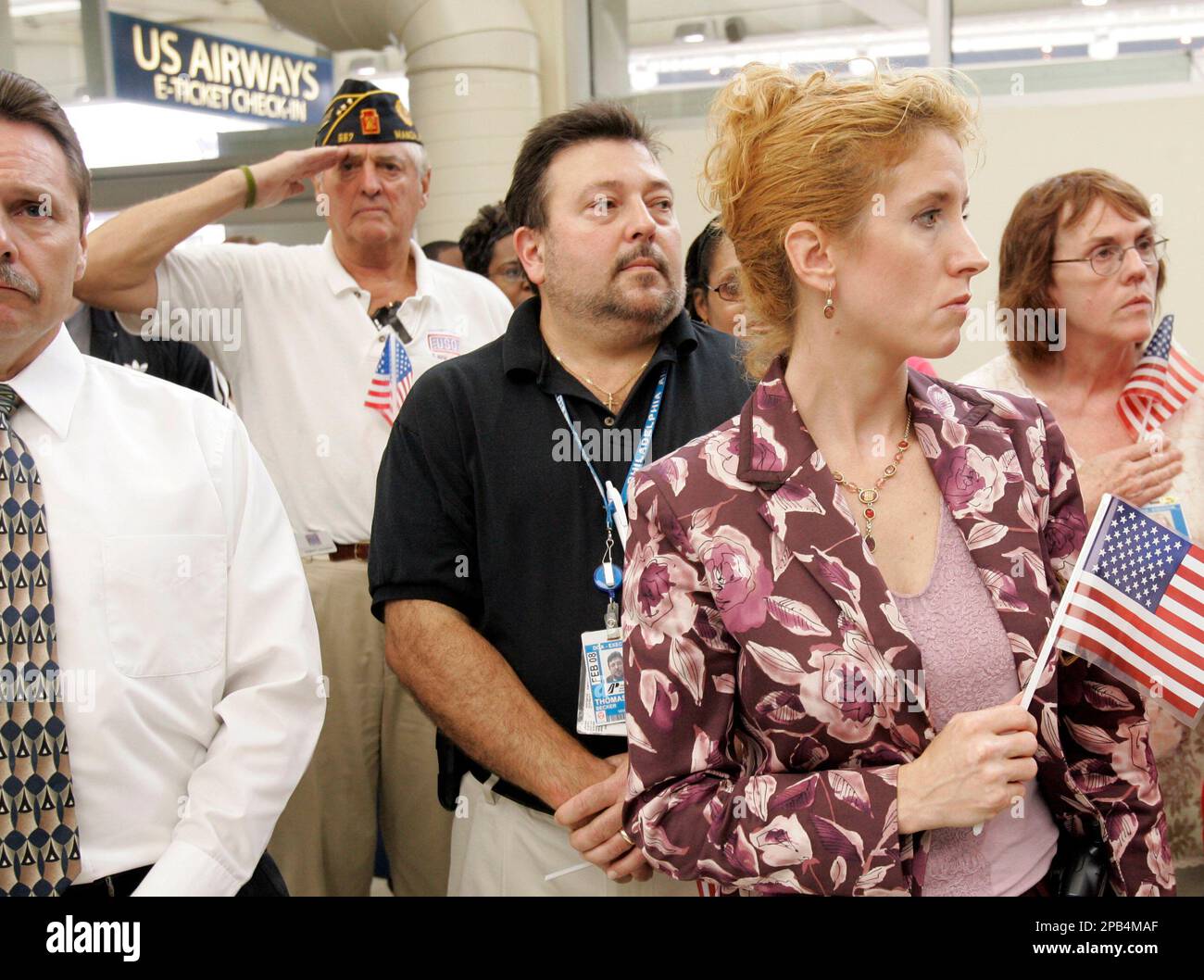 Airport employees and members of the public gather at the Philadelphia ...