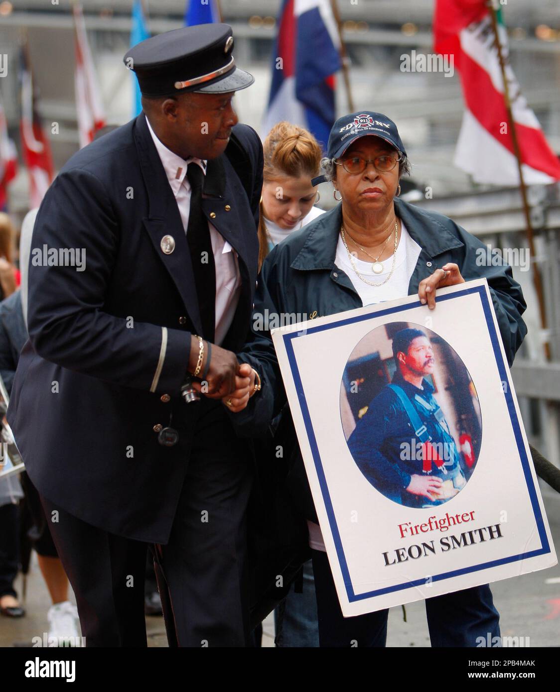 Family members of New York City firefighter Leon Smith walk out of ground zero during ceremonies ...
