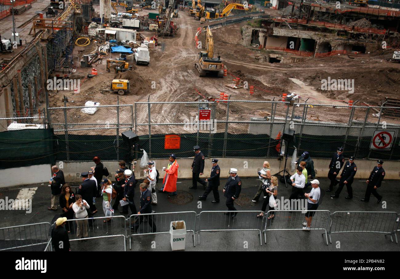 Friends and family members walk down Liberty Street outside the World ...