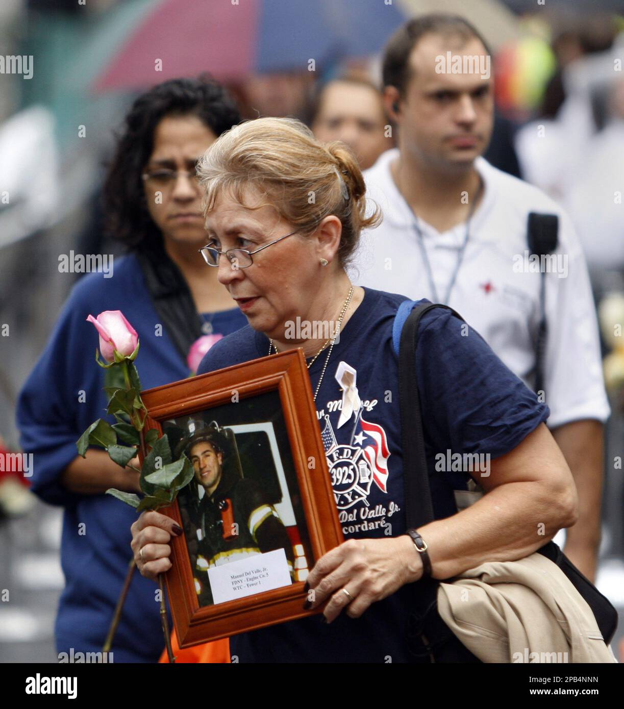 Families of victims walk into ground zero during ceremonies at the ...