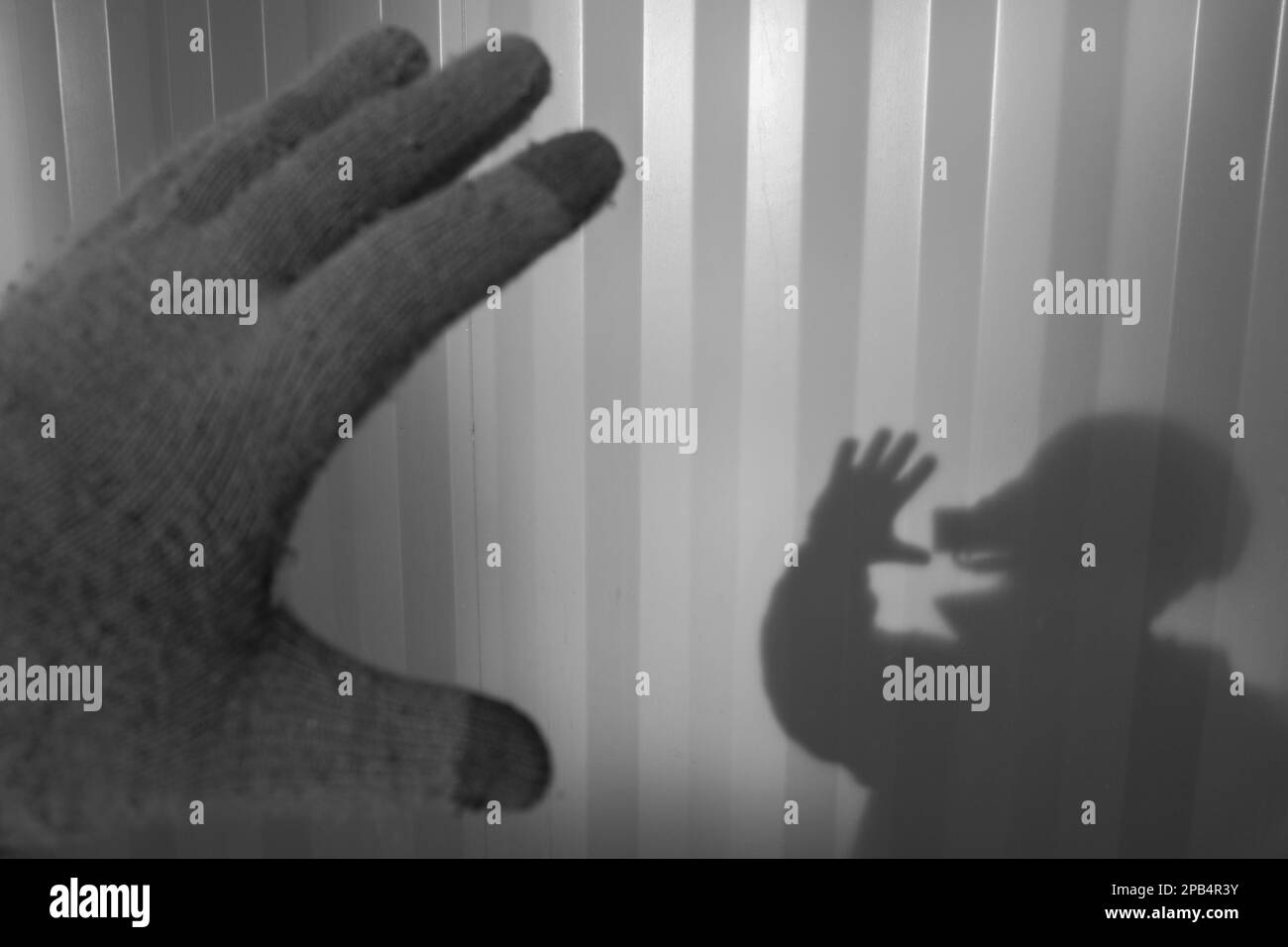 Man shadow on wall Black and White Stock Photos & Images - Alamy