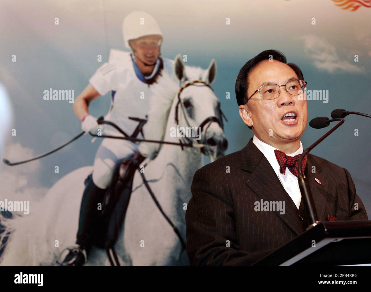Hong Kong leader Donald Tsang speaks in front of a Hong Kong Olympic ...
