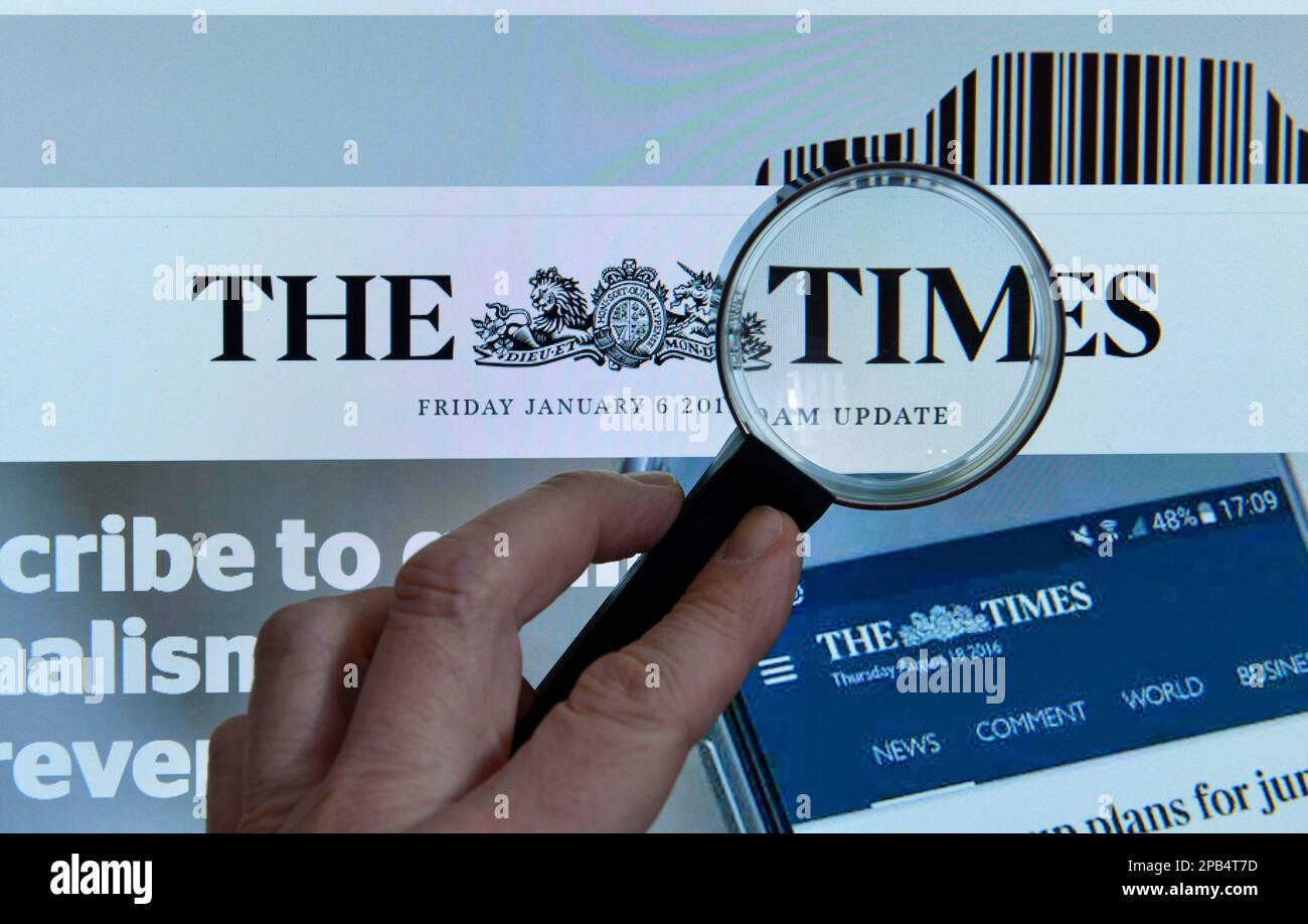 The Times, Internet, screen, Hand, Magnifier Stock Photo - Alamy